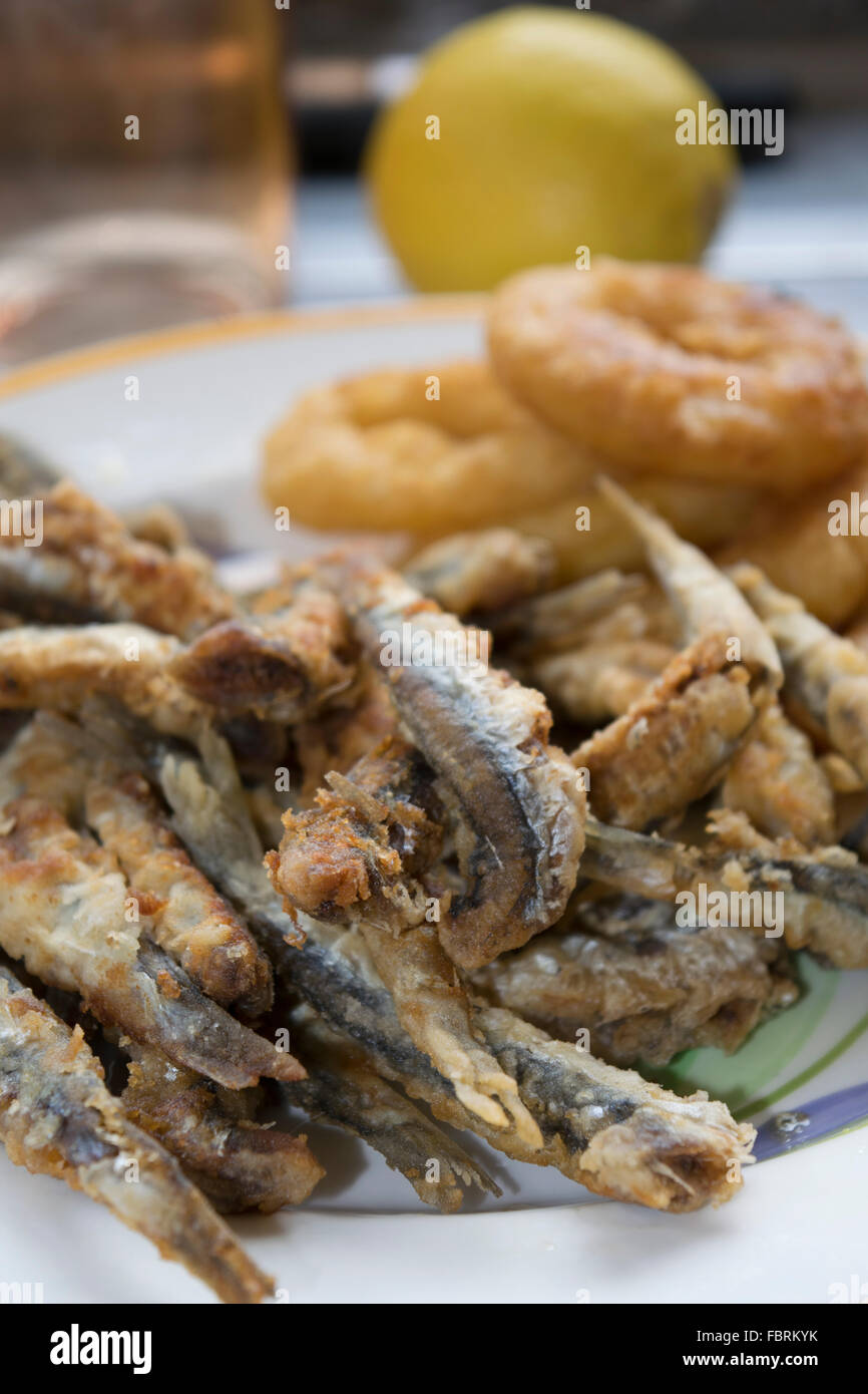 mixed fish fry with anchovied and battered calamari Stock Photo - Alamy