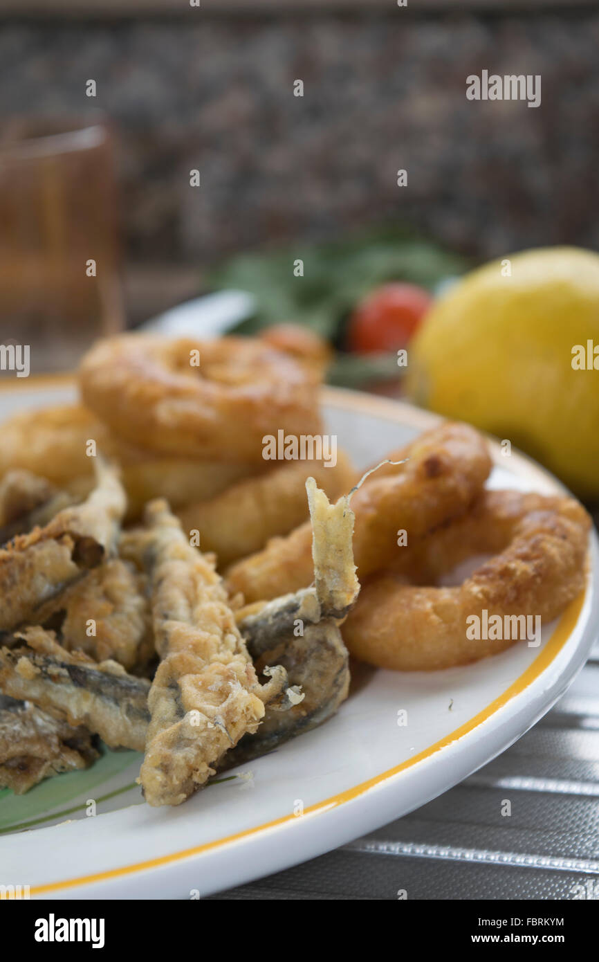 mixed fish fry with anchovied and battered calamari Stock Photo - Alamy