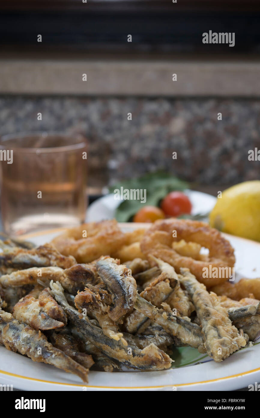 mixed fish fry with anchovied and battered calamari Stock Photo - Alamy