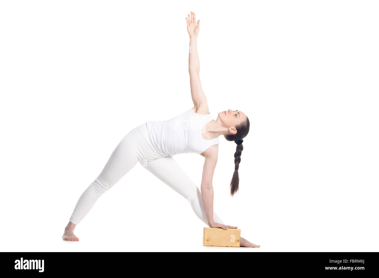 Sporty beautiful young beginning yoga female student standing in ...