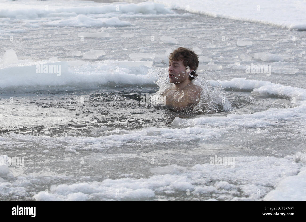 Kiev, Ukraine. 4th Dec, 2015. Man is bathing in the ice-hole in the ...