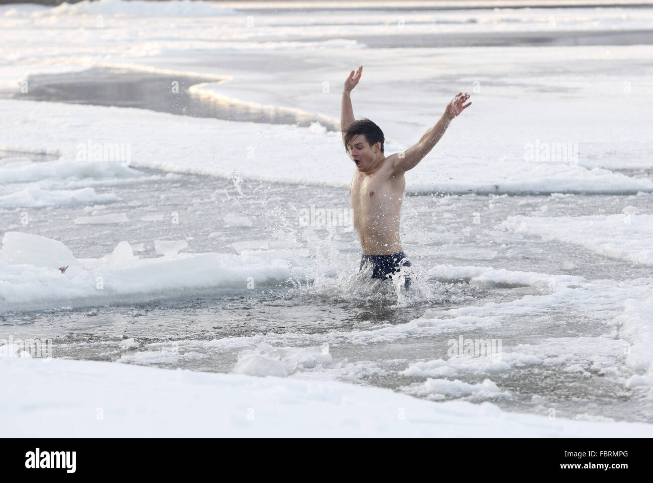 Kiev, Ukraine. 4th Dec, 2015. Man is bathing in the ice-hole in the ...