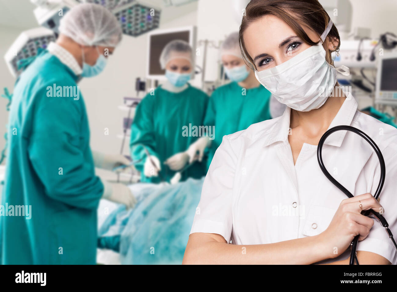 Surgery team operating Stock Photo - Alamy