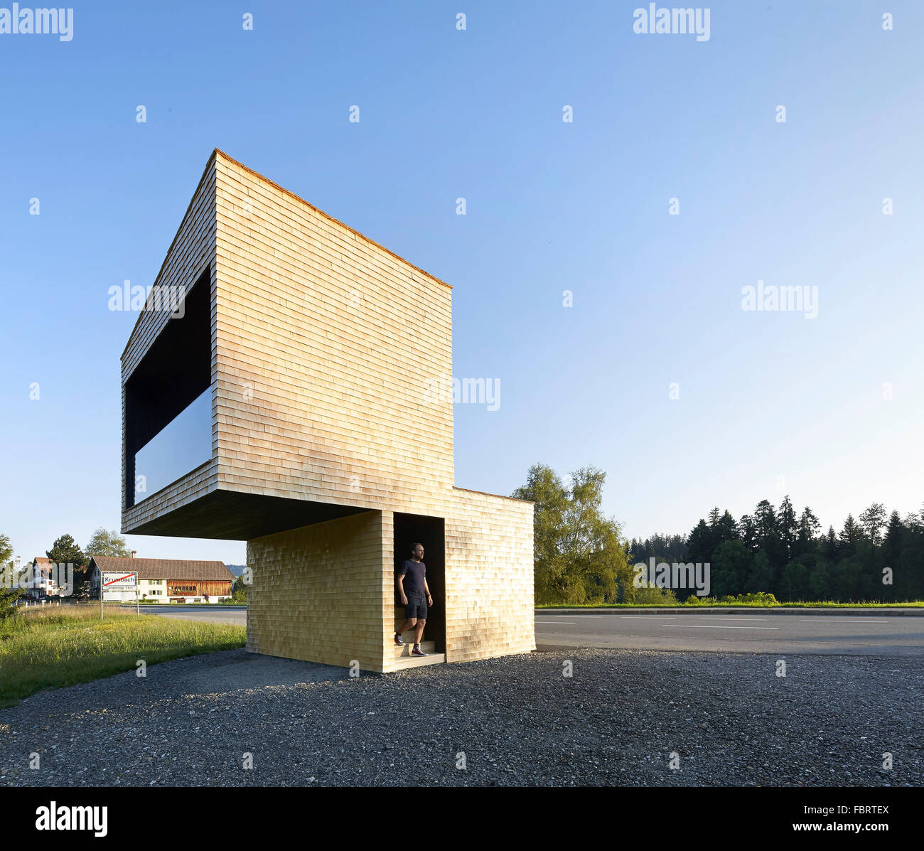 Side elevation of cubic structure with man waiting. Bus Stop Kressbad ...