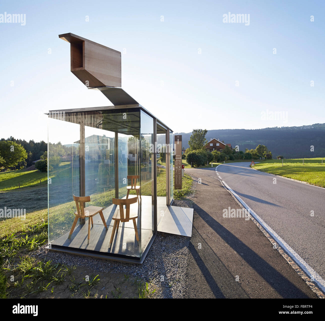 Back lit bus shelter on roadside. Bus Stop Zwing by Smiljan Radic ...