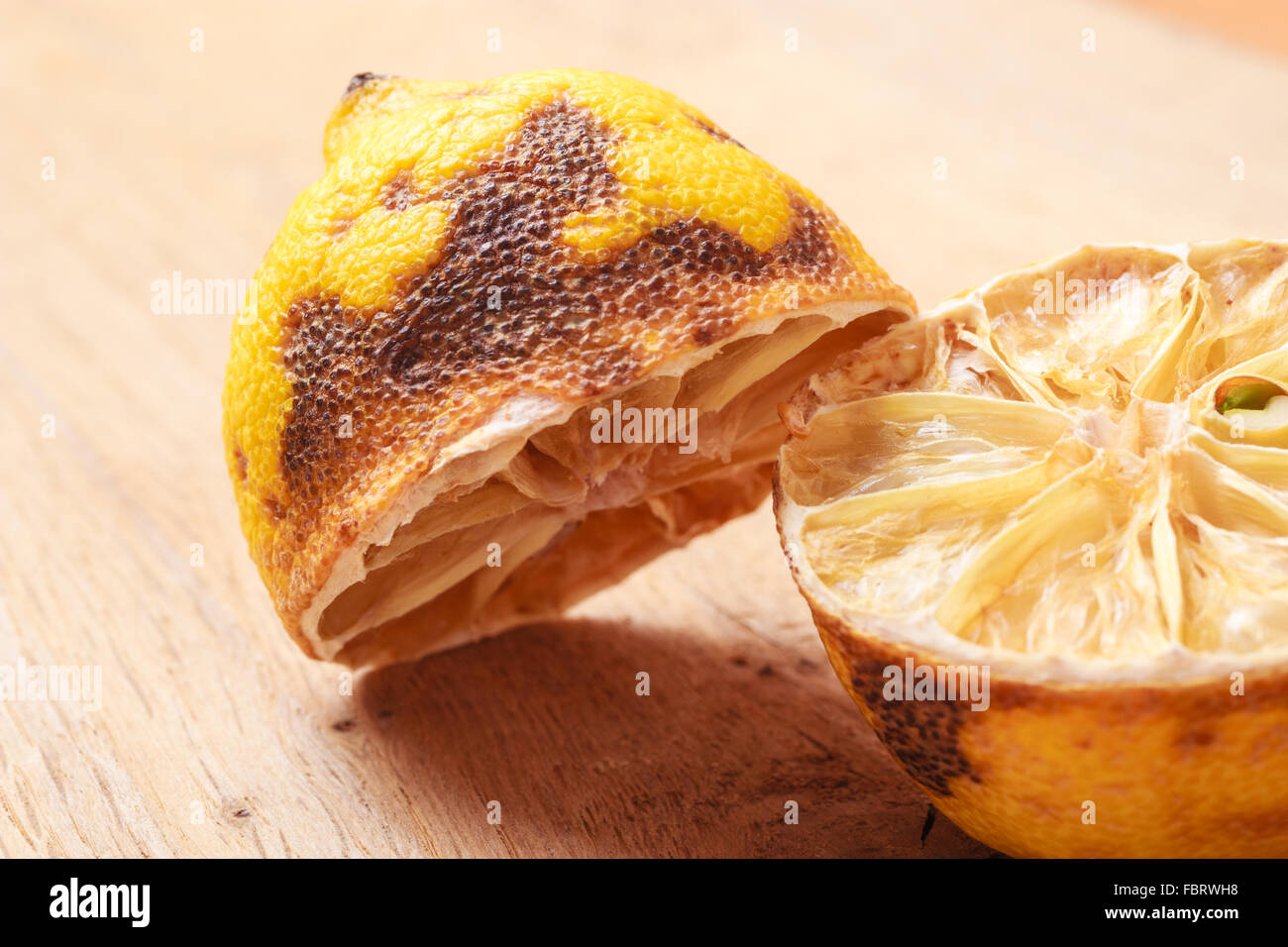 Closeup old rotten piece of lemon. Bad unhealthy food Stock Photo - Alamy