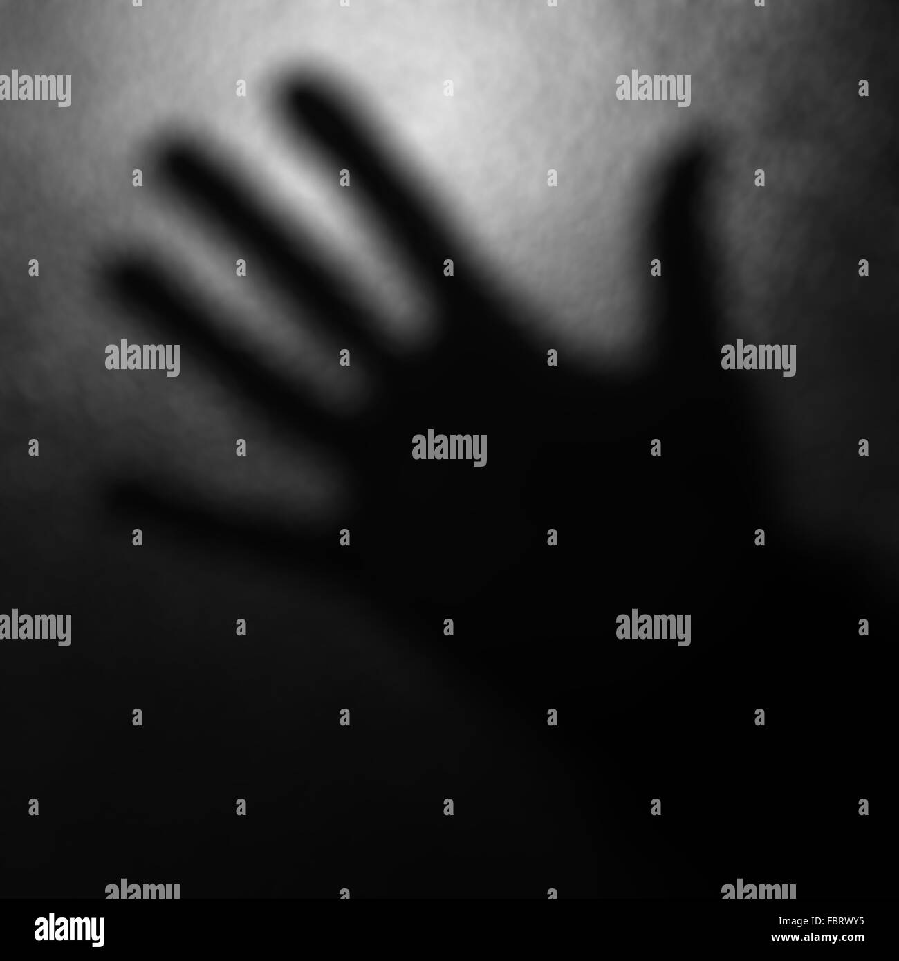Blurred black and white background with one hand Stock Photo - Alamy
