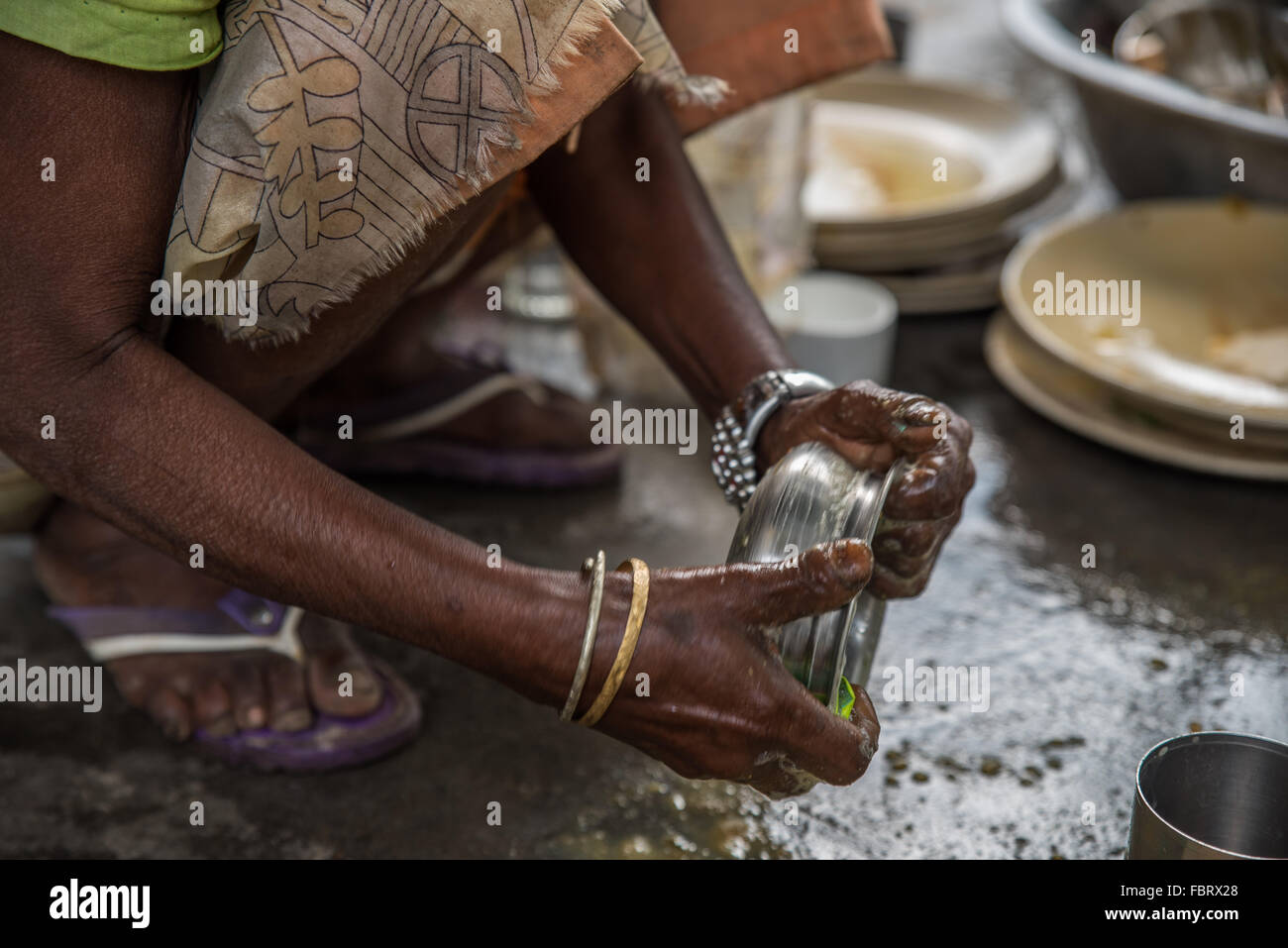 Close up study of Indian lady hands in action washing, scrubbing and ...
