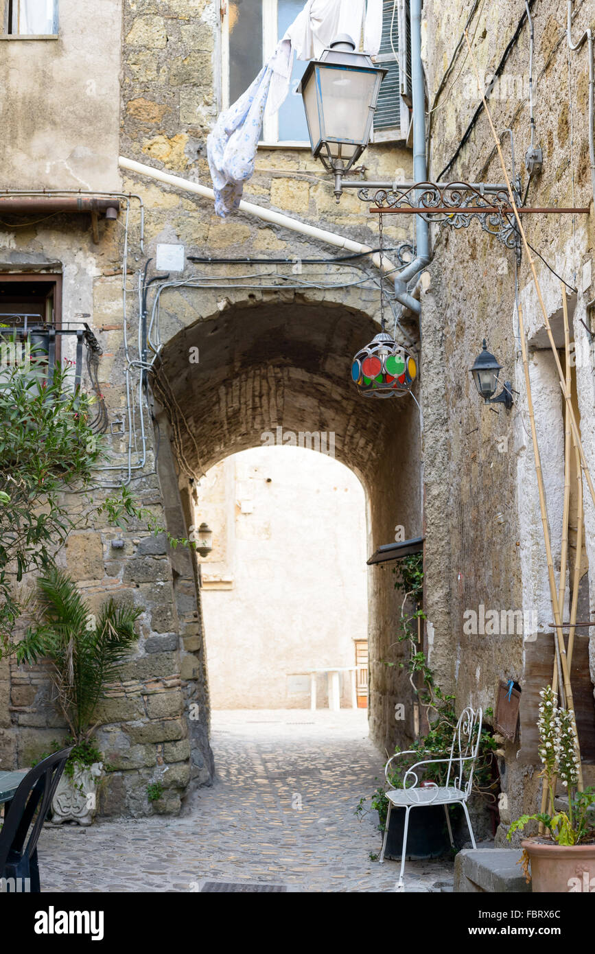 little street with arc in an ancient village called Calcata, near Rome ...