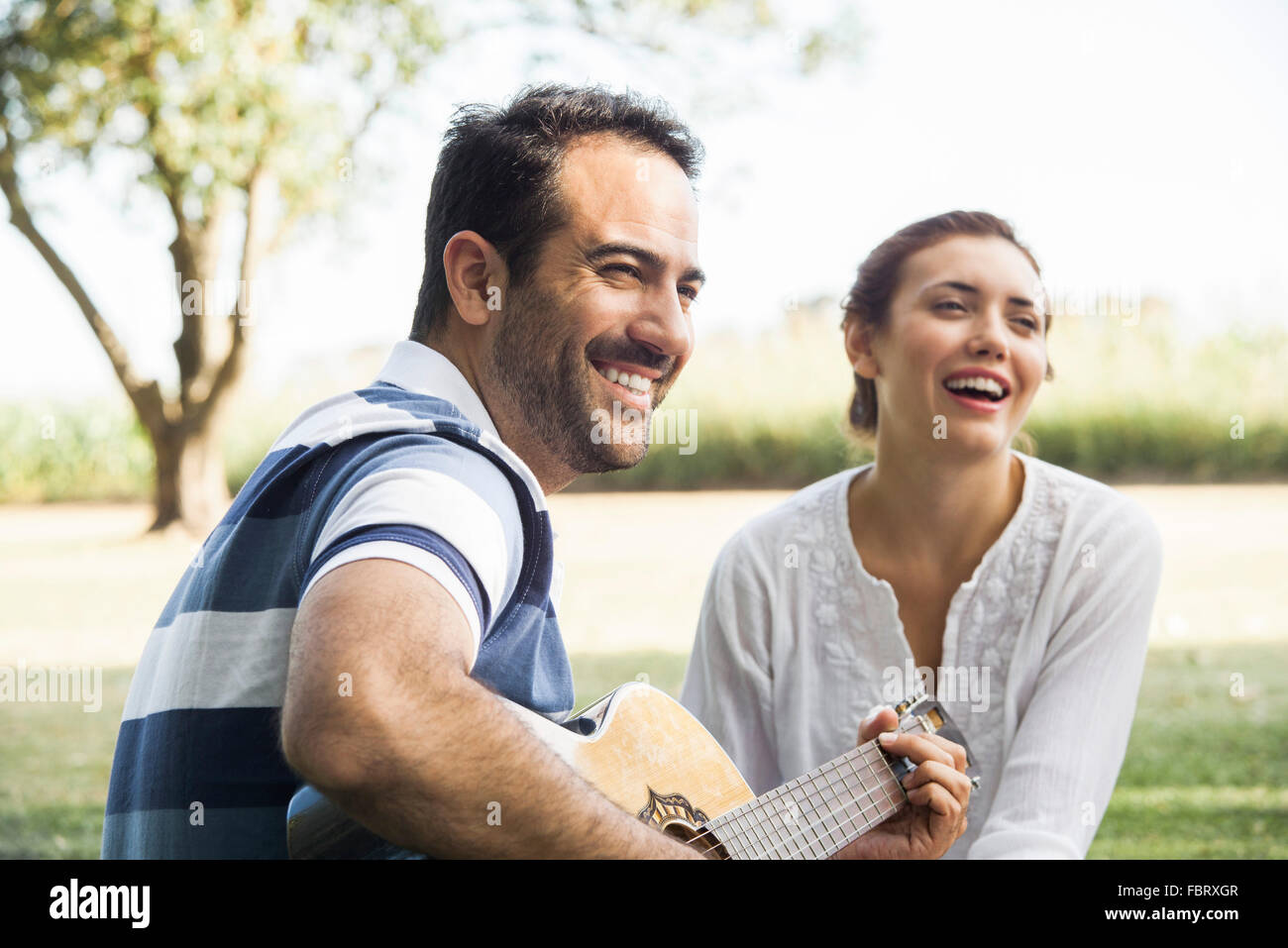 Relaxing in the park with friends Stock Photo - Alamy