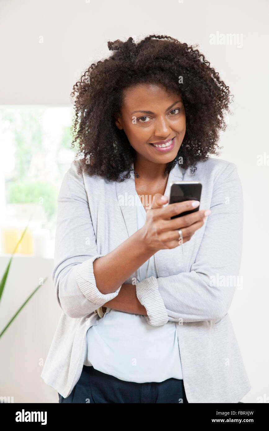 Woman text messaging Stock Photo - Alamy