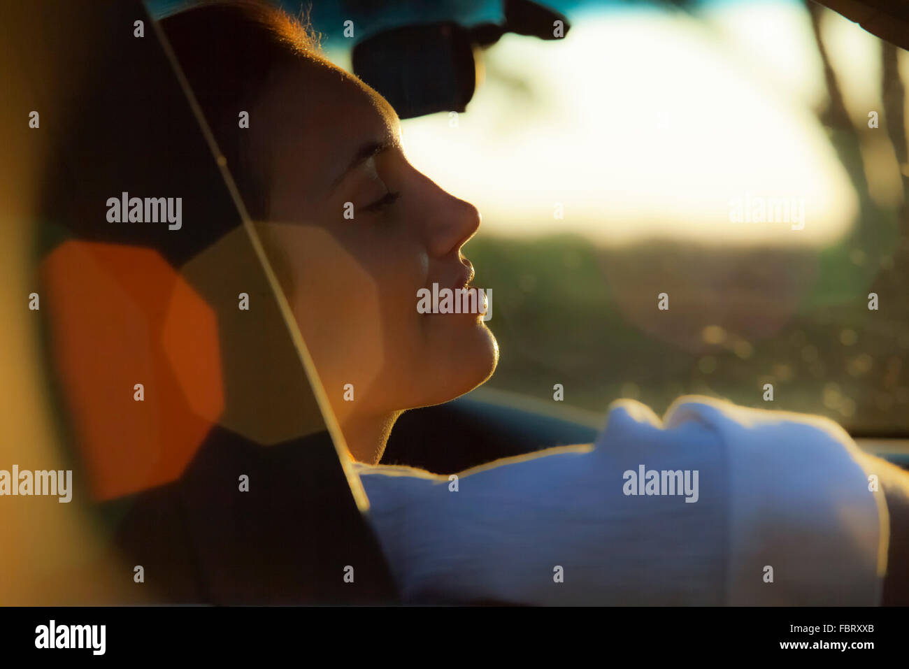 Woman passenger riding in car Stock Photo - Alamy