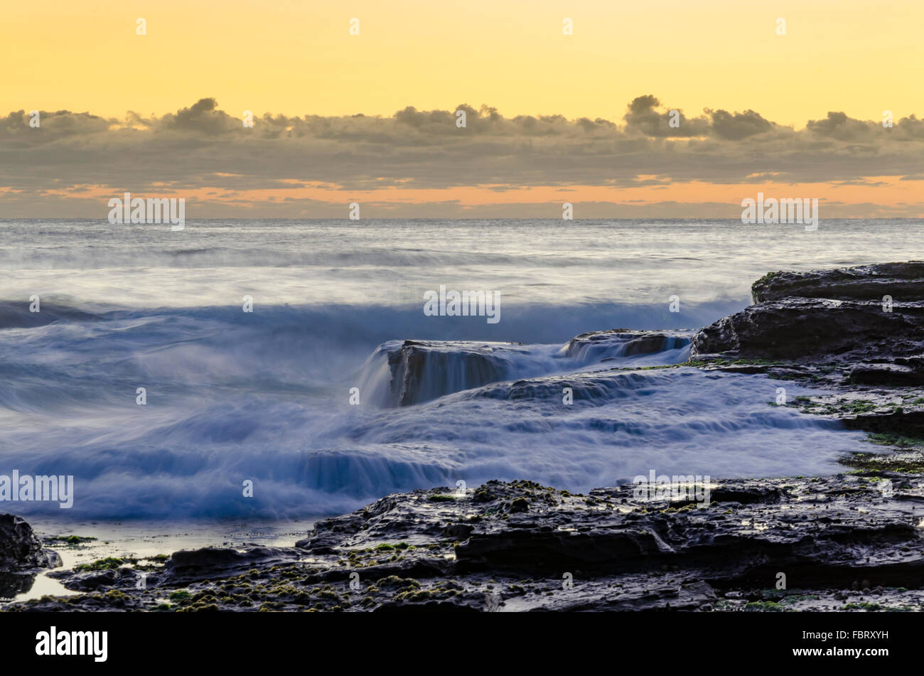 Waves spilling over rocks hi-res stock photography and images - Alamy