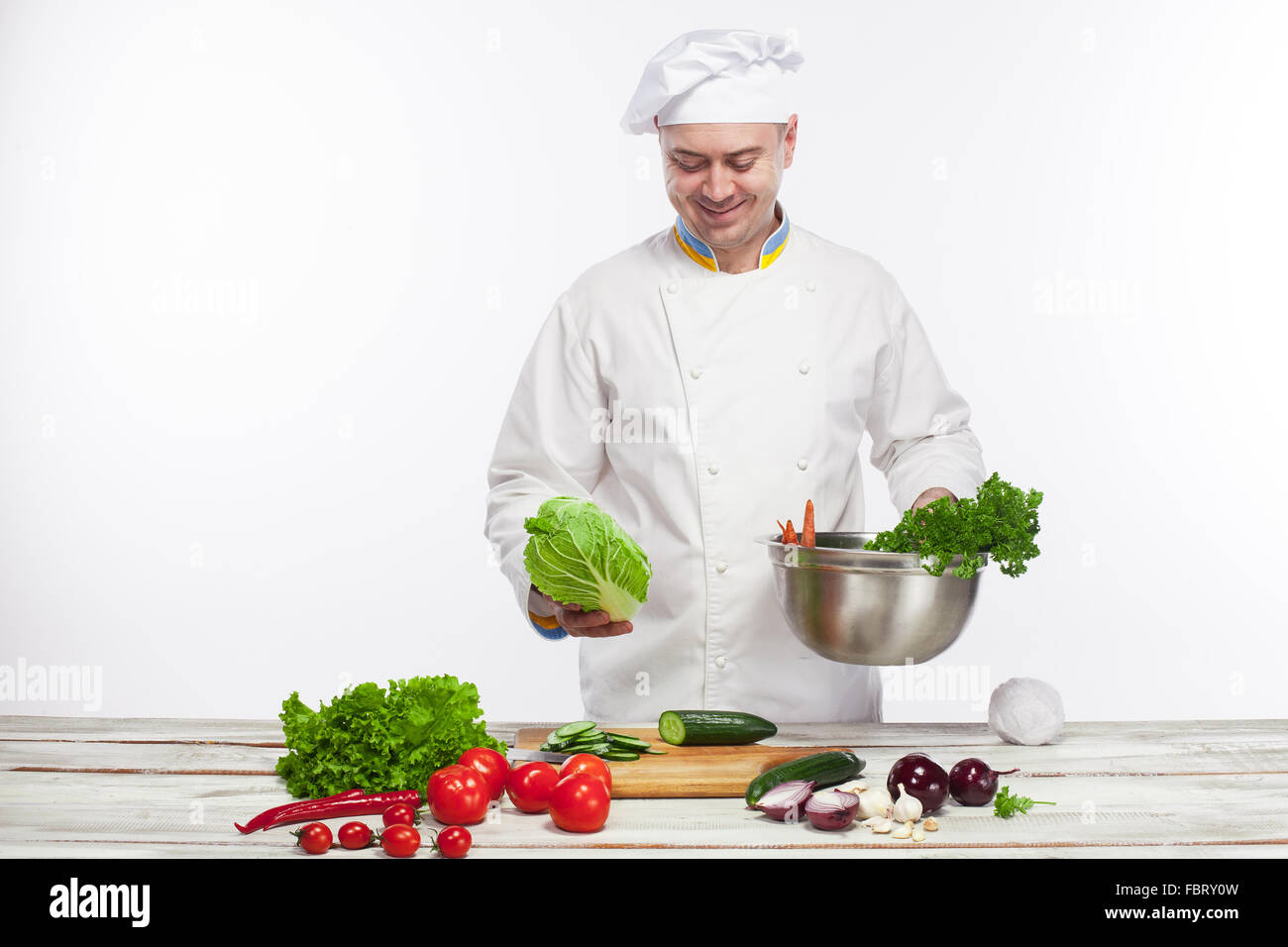 Chef cooking fresh vegetable salad in his kitchen Stock Photo - Alamy