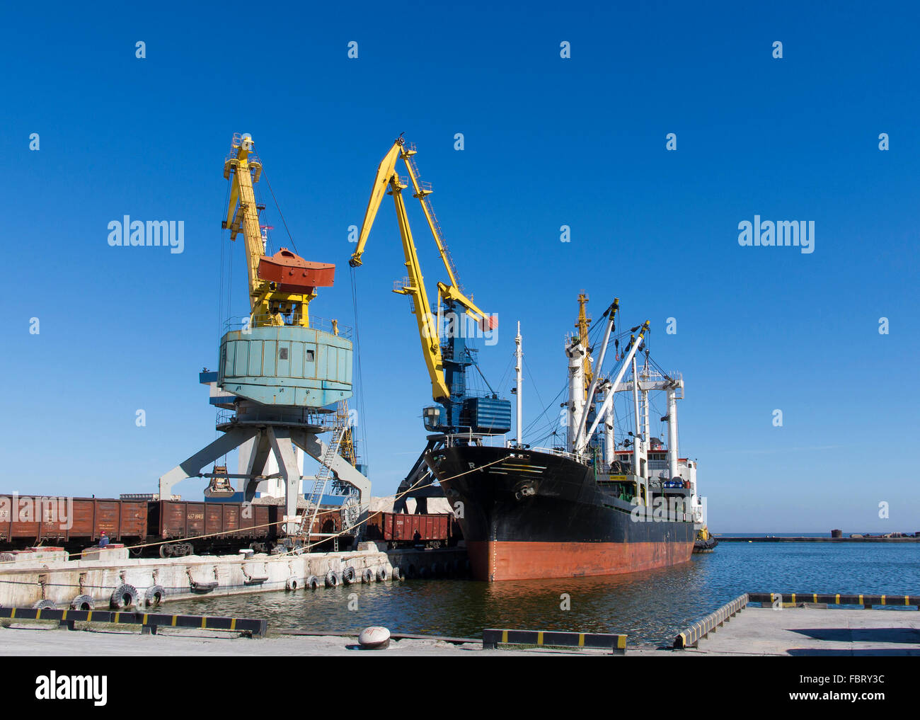 cargo ship on loading in sea port of Mariupol Stock Photo - Alamy