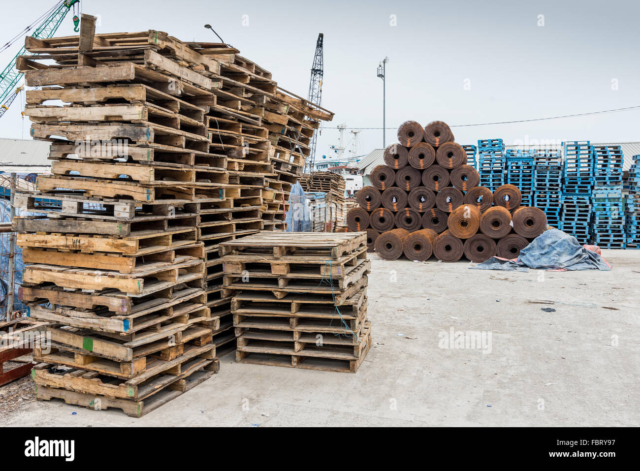 Stacks of pallets and coils of steel matting piled up at Jakarta old ...