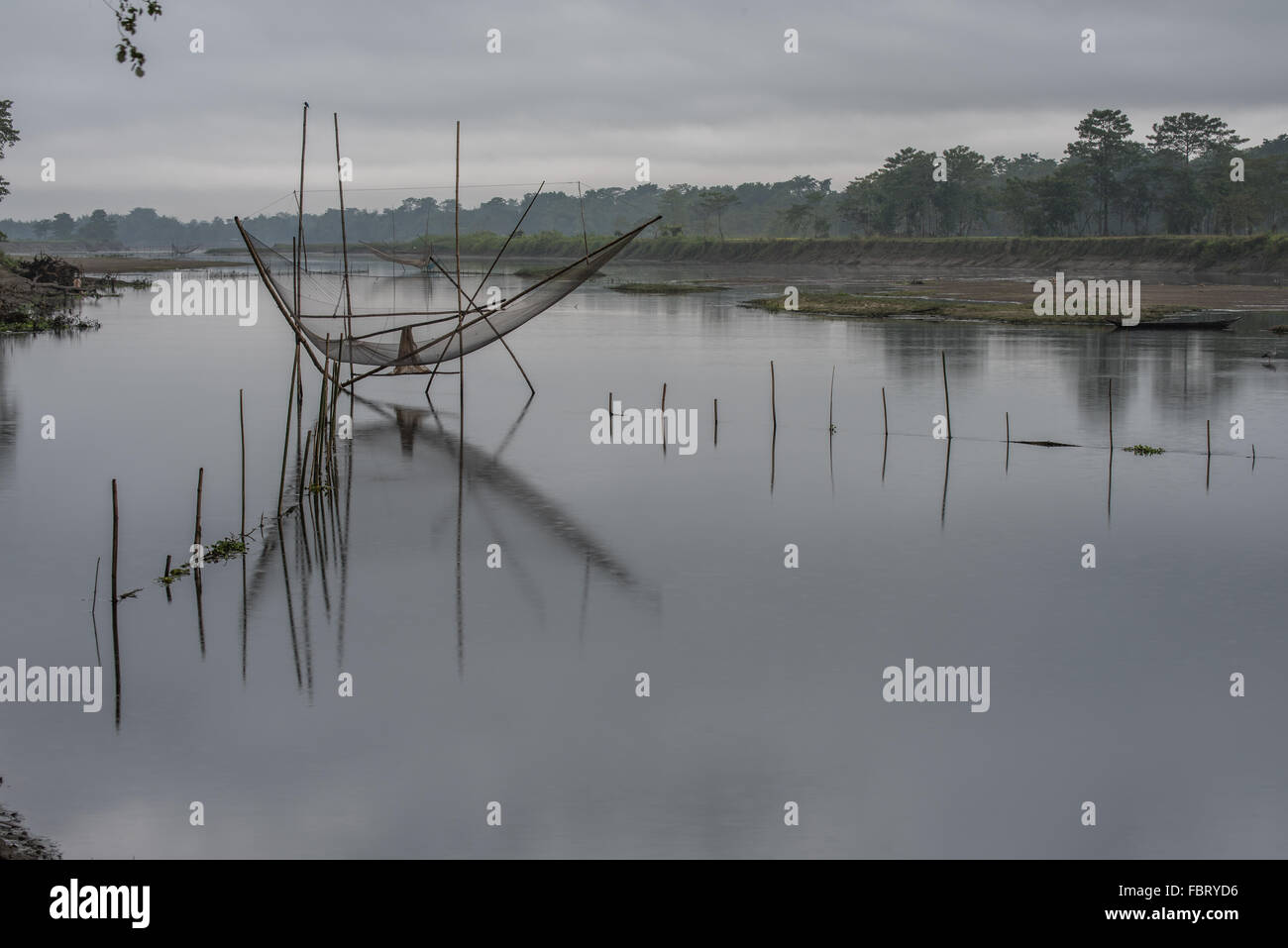 Fishing nets set up by the local indigenous Mishing people. At dawn on ...
