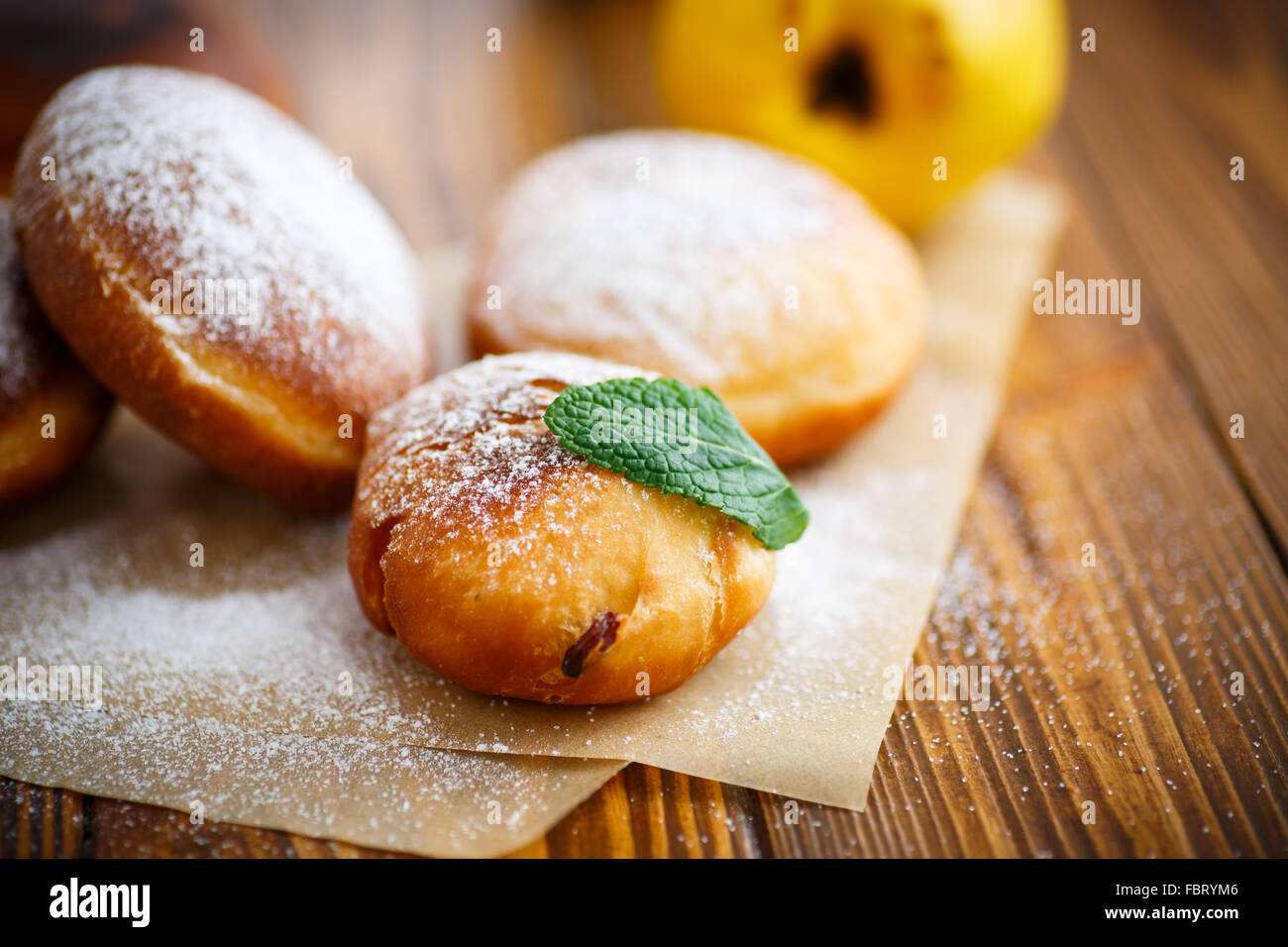 fried donuts with quince inside Stock Photo - Alamy
