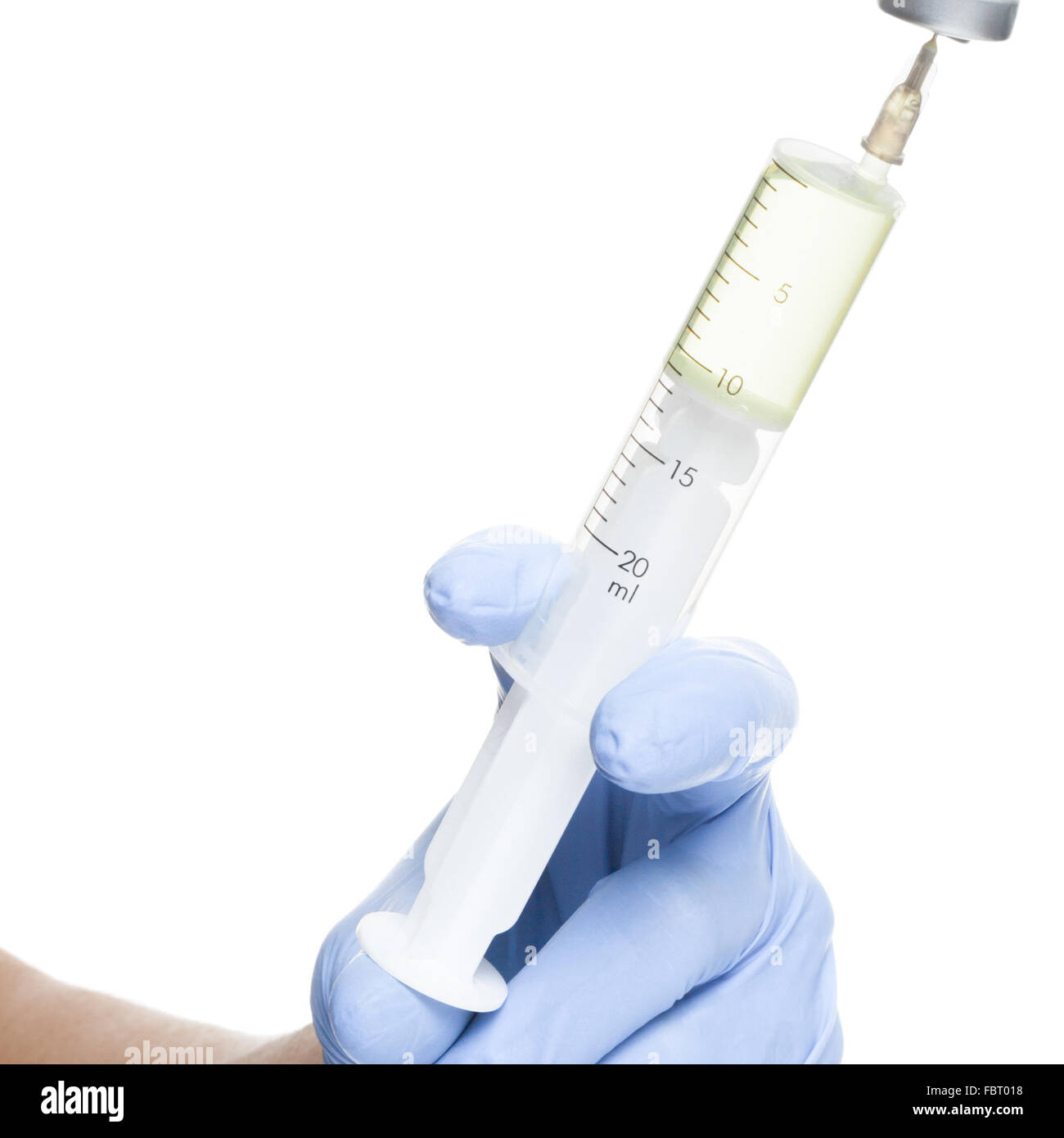 Male in gloves injecting medicine into a pack with medical solution ...