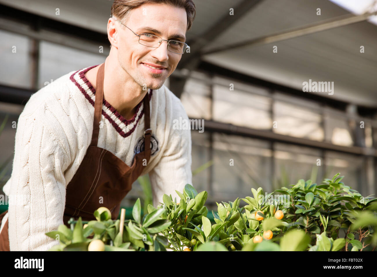 Attractive male gardener hi-res stock photography and images - Alamy