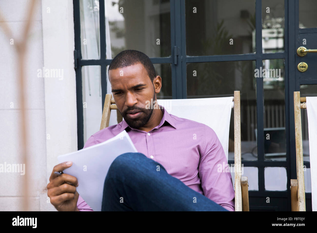 Man reading letter Stock Photo - Alamy