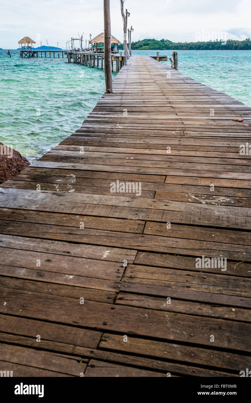 Long wood bridge on the beach in Kohmak island, Thailand Stock Photo ...