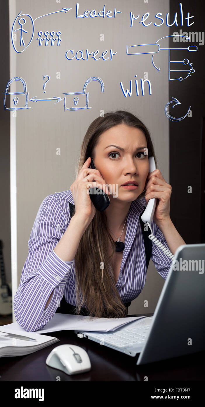 Office worker talking on two cell phone Stock Photo - Alamy