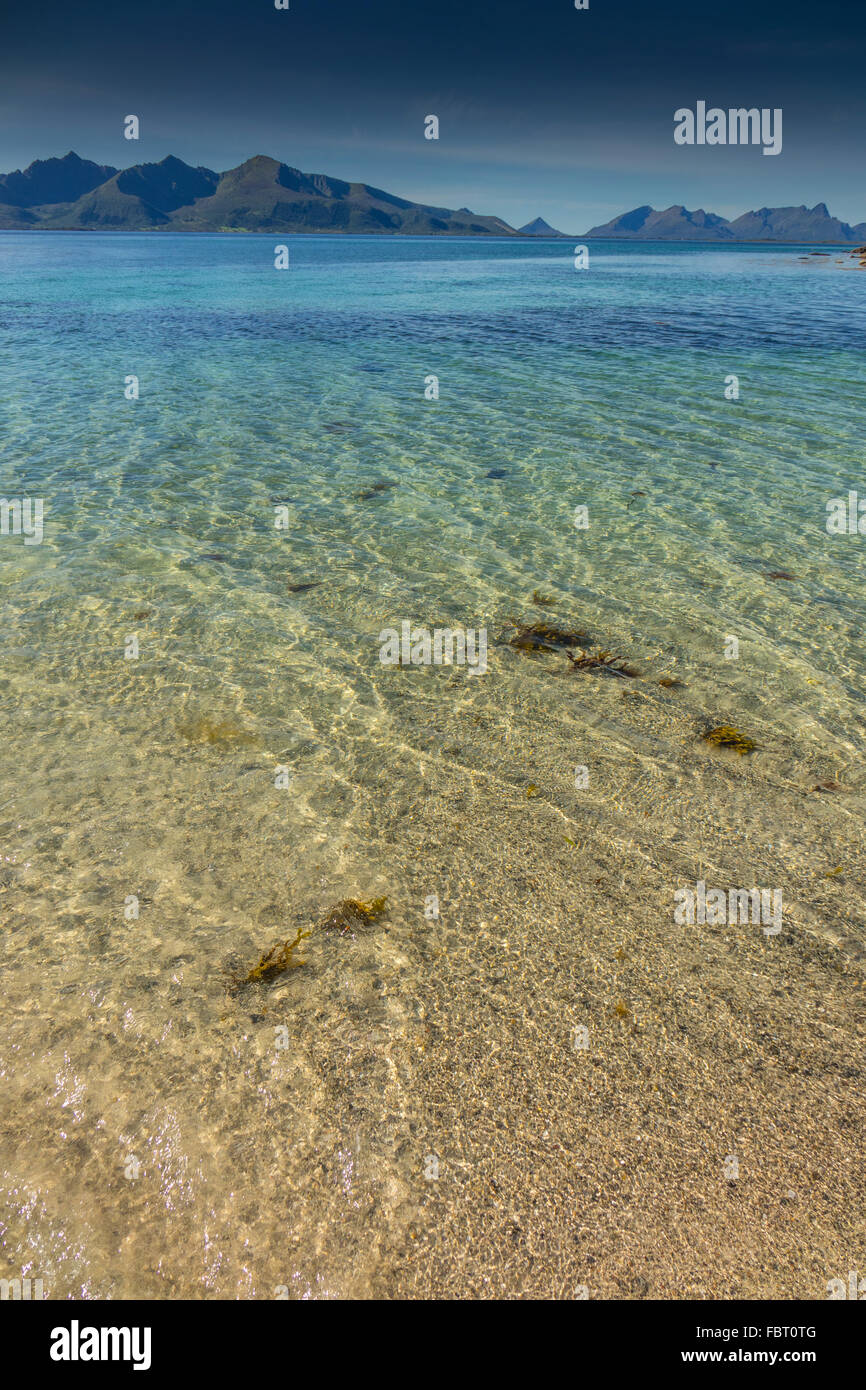 Clear shallow sea water with distant island, Arctic Norway Stock Photo ...