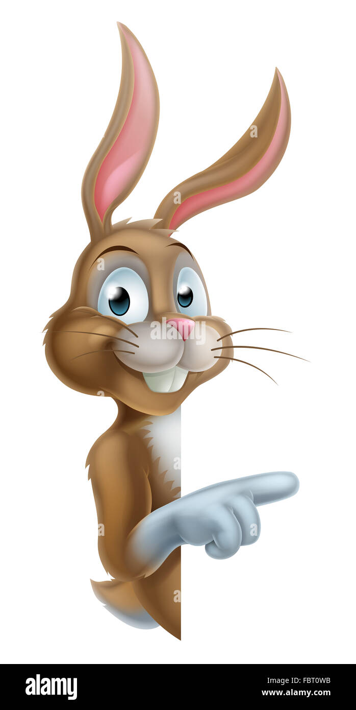 A pointing cartoon Easter bunny rabbit Stock Photo - Alamy