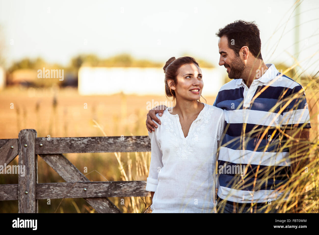 Couple on walk through countryside Stock Photo - Alamy