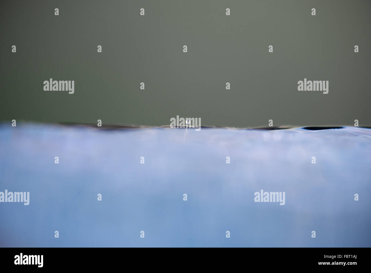 Droplet falling on water Stock Photo - Alamy