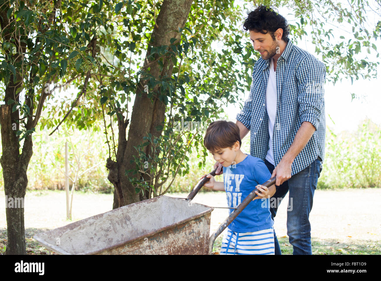 Wheelbarrows children hi-res stock photography and images - Alamy