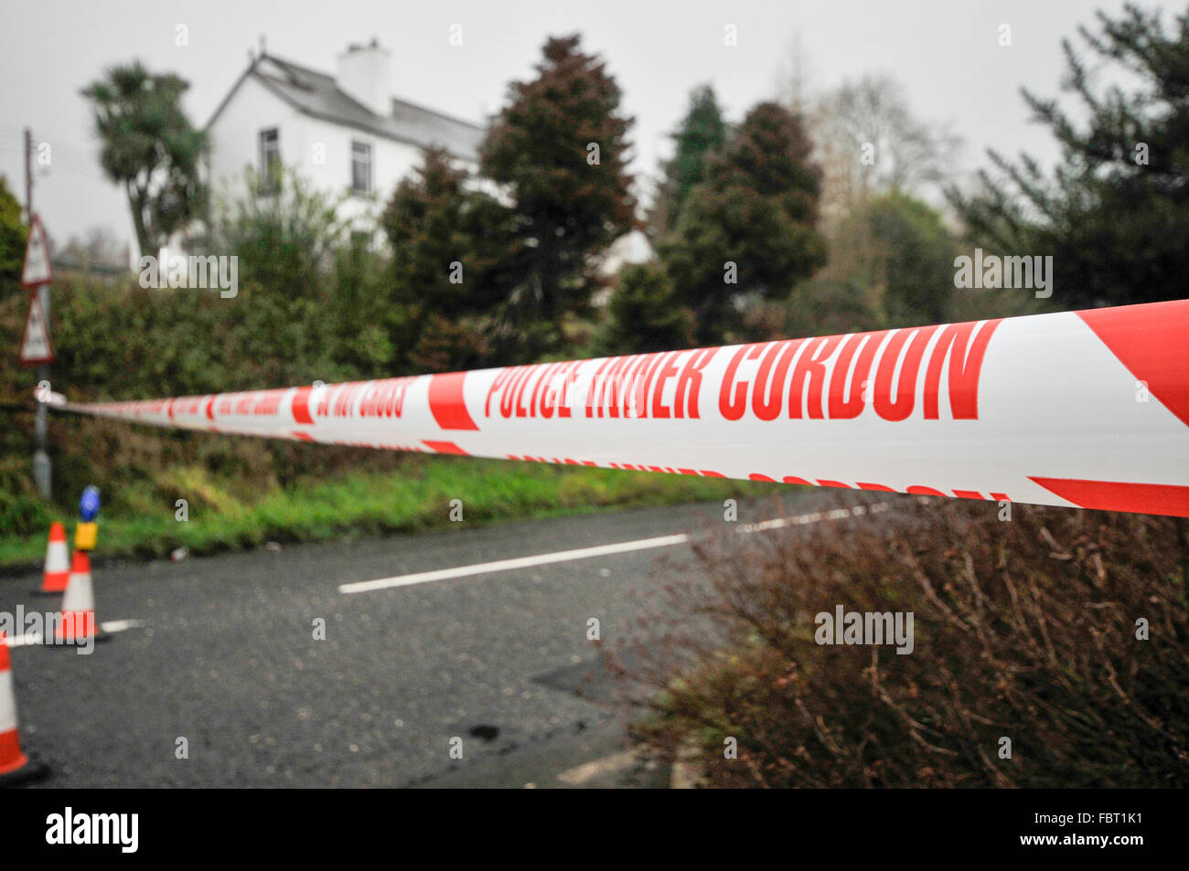 Police "Inner Cordon" tape is stretched across a road at the scene of a ...