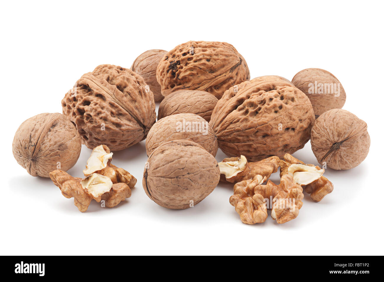 Walnut fruit group closeup isolated on white Stock Photo - Alamy