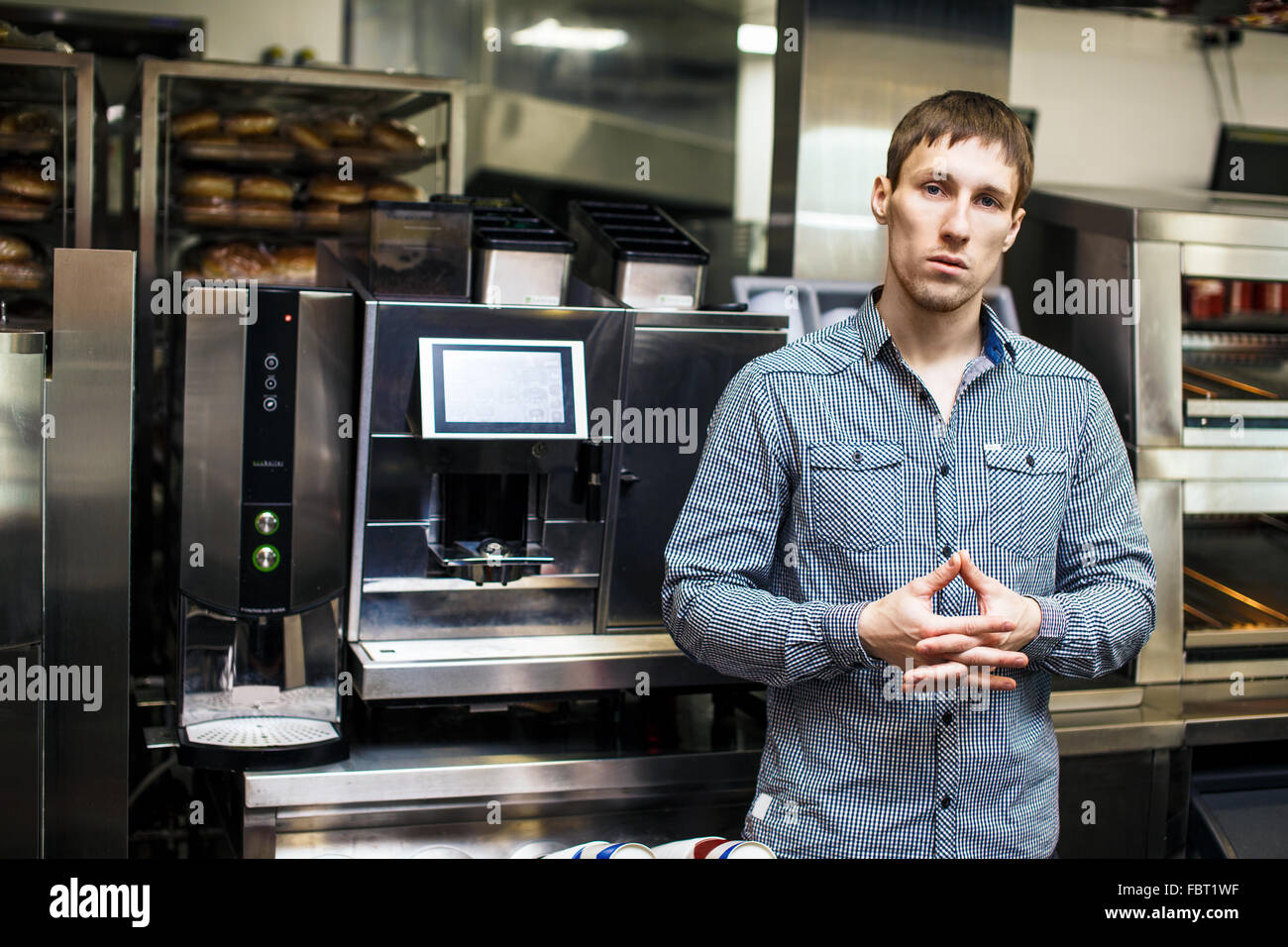 Barista standing with coffee maker Stock Photo - Alamy