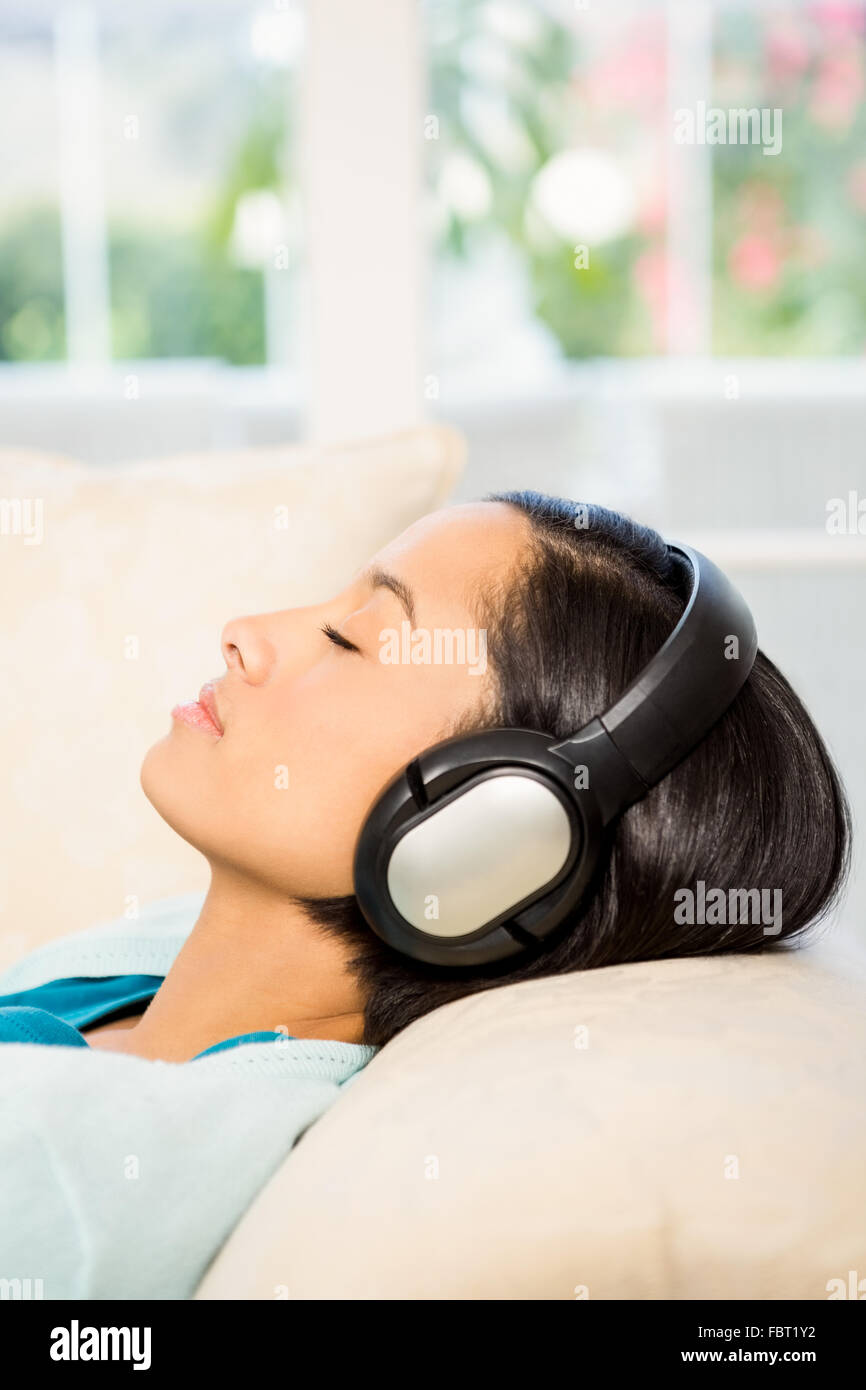 Relaxed brunette with headphones Stock Photo - Alamy