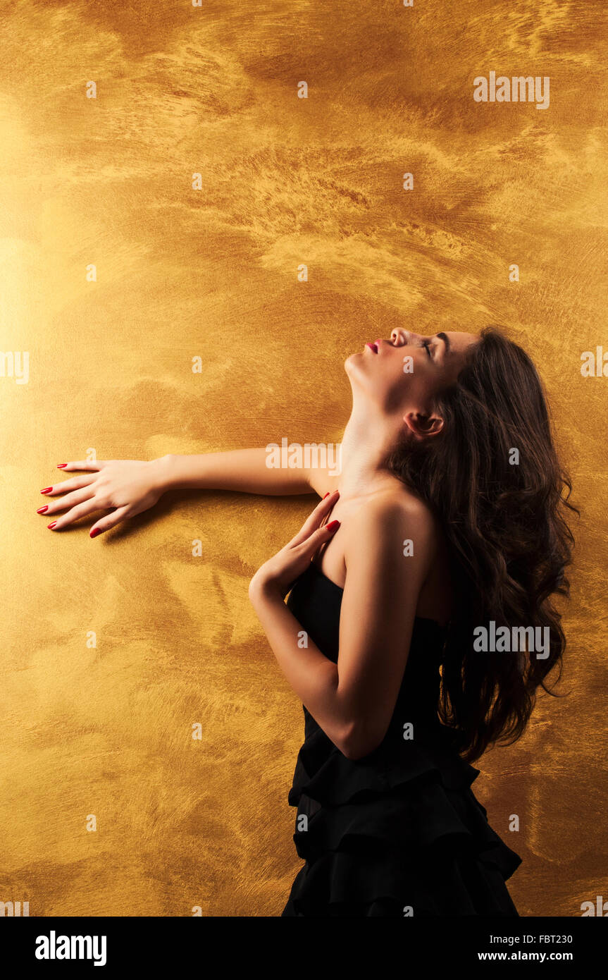 Beautiful young woman hand over heart Stock Photo - Alamy