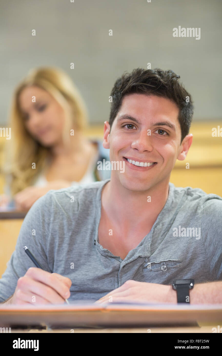 Smiling male student during class Stock Photo - Alamy