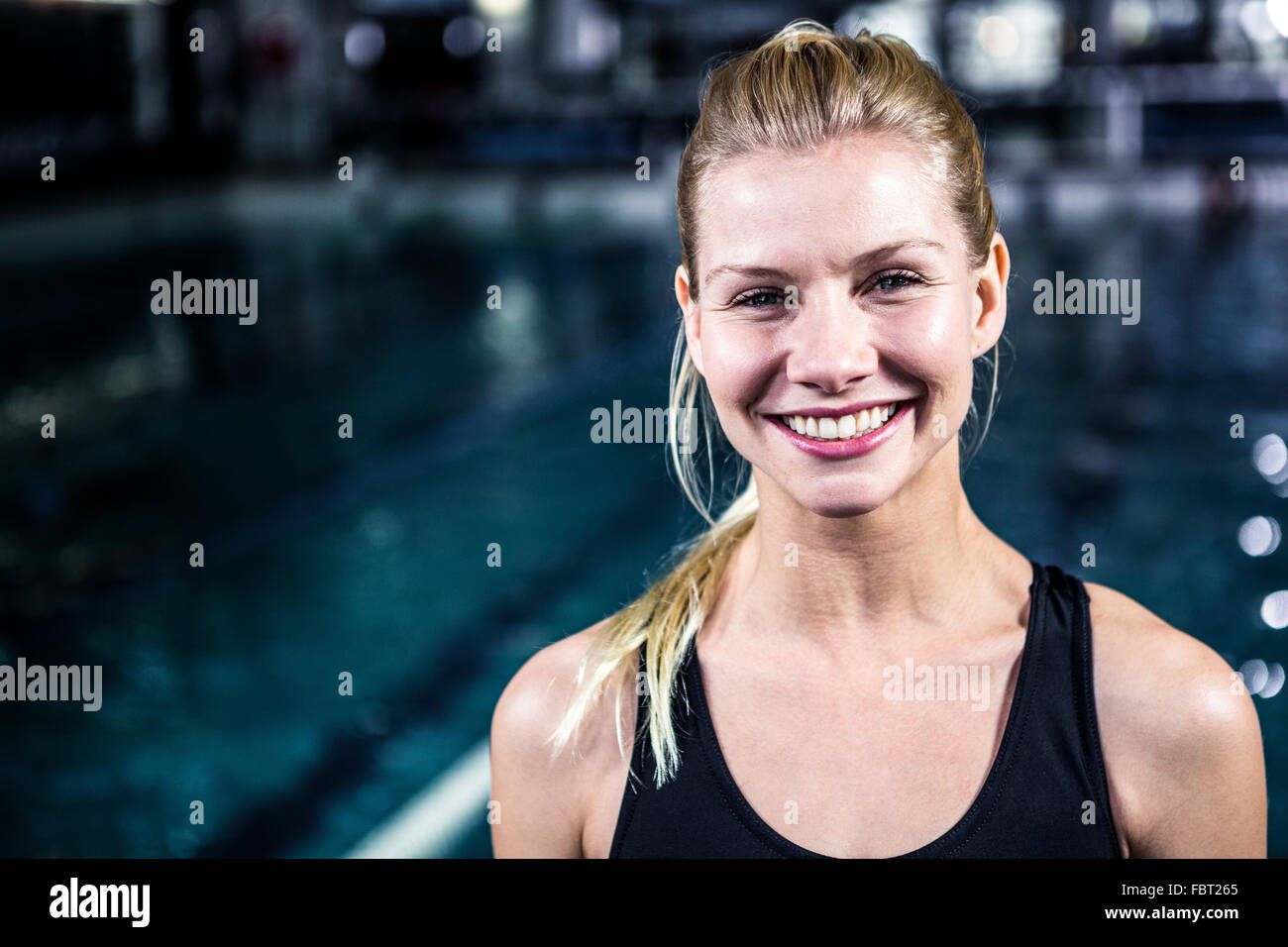 Portrait of a woman swimmer looking the camera Stock Photo - Alamy