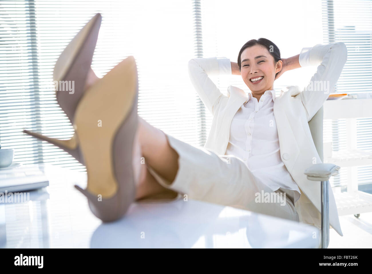 Woman relaxed feet up hi-res stock photography and images - Alamy