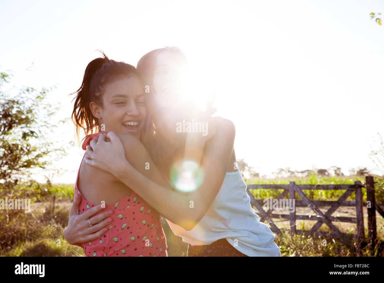 Friends embracing, portrait Stock Photo - Alamy