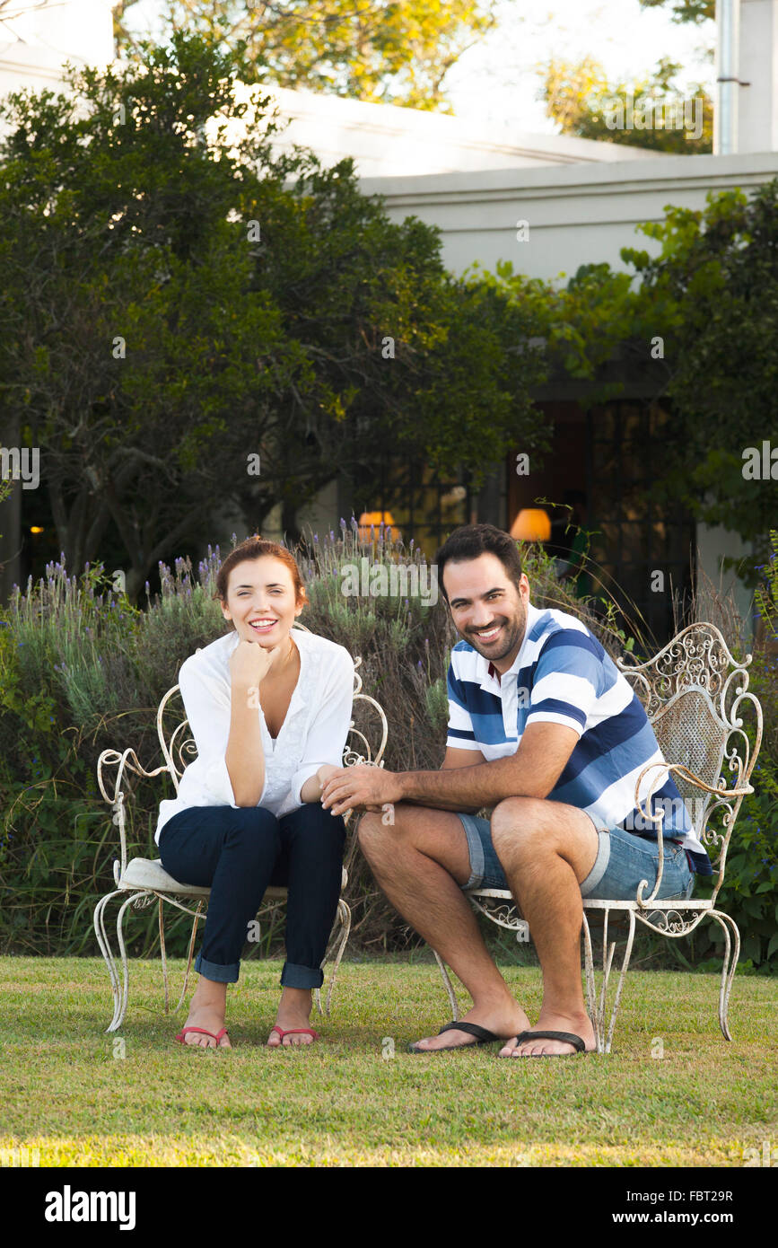 Couple relaxing together outdoors, portrait Stock Photo - Alamy