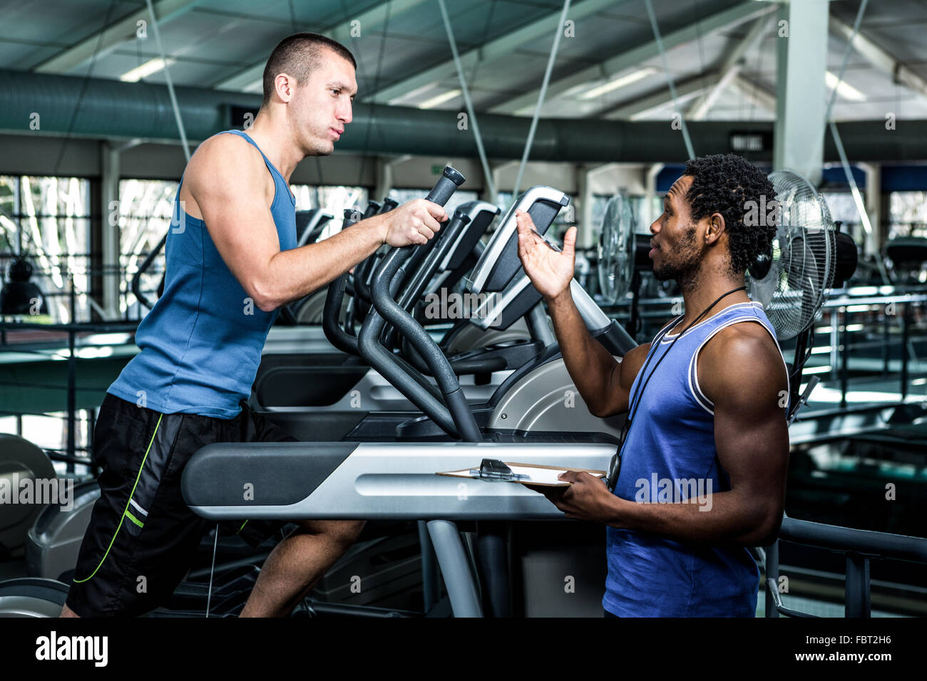 Muscular man using elliptical hi-res stock photography and images - Alamy