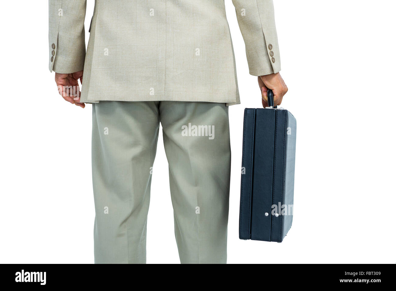 Businessman holding a briefcase Stock Photo - Alamy