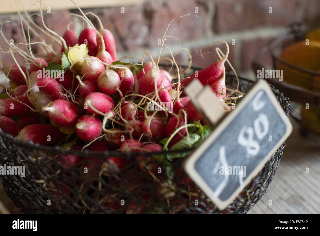 Fresh radishes in basket Stock Photo - Alamy