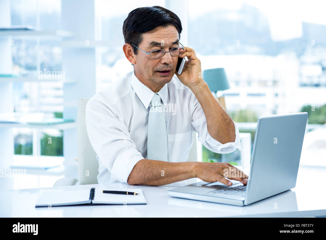 Professional busy senior asian hi-res stock photography and images - Alamy