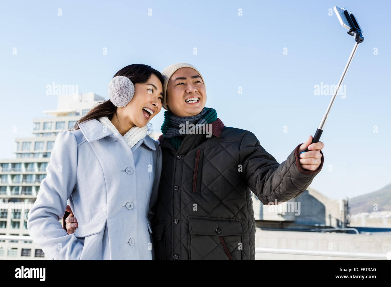 Couples taking funny pictures using smartphone Stock Photo - Alamy