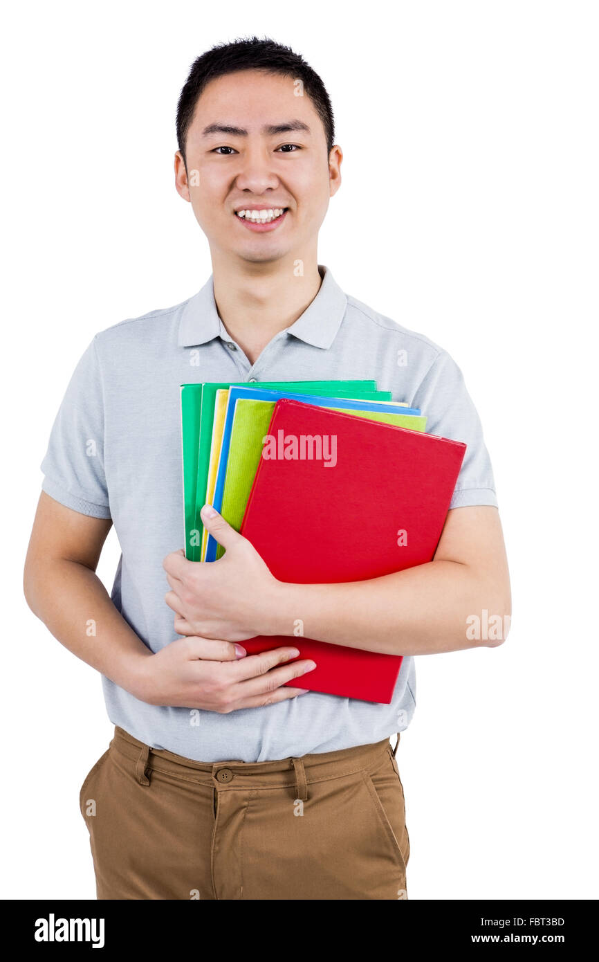 Smiling man holding files Stock Photo - Alamy