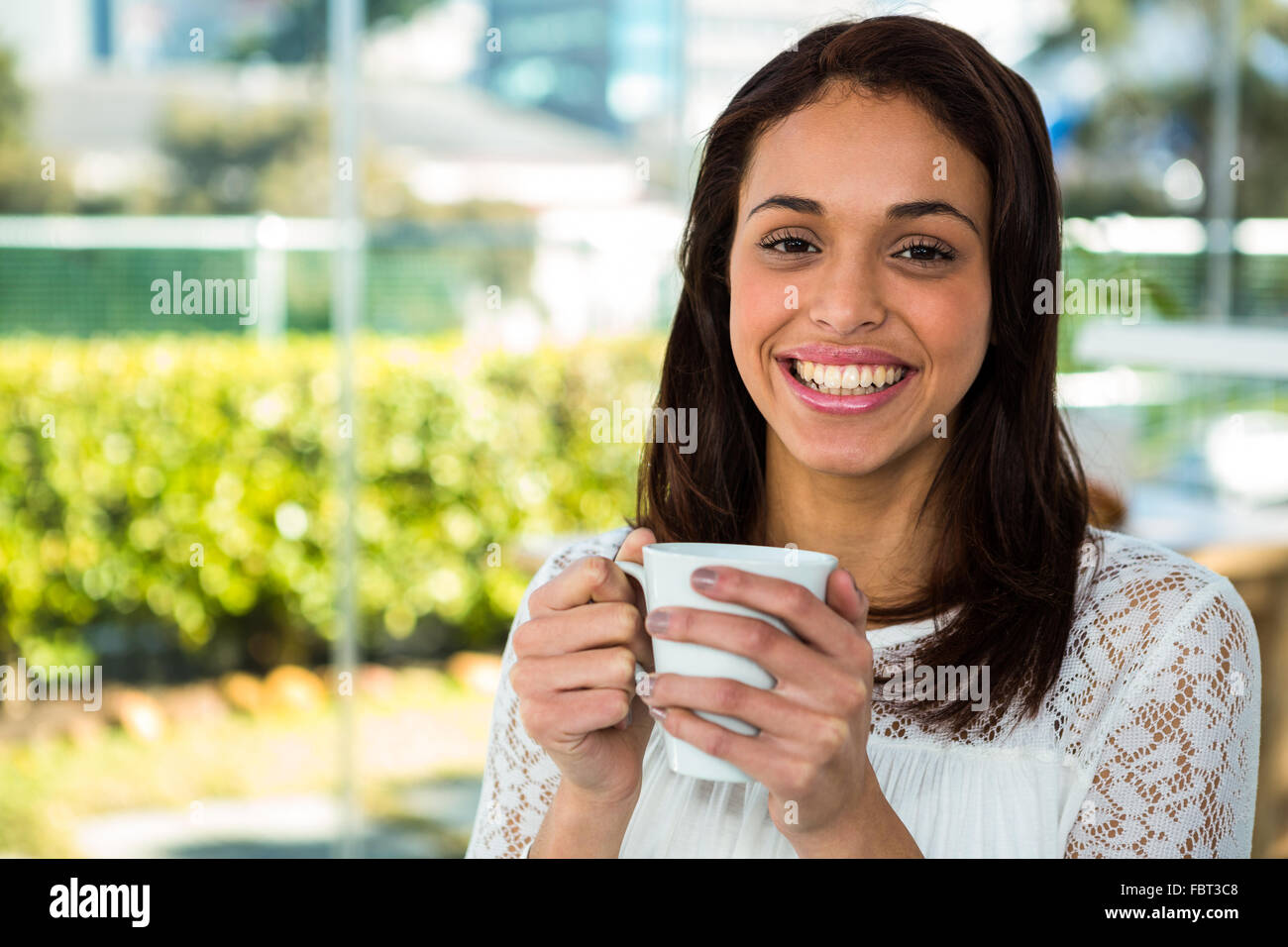 Young girl drink her tea Stock Photo - Alamy