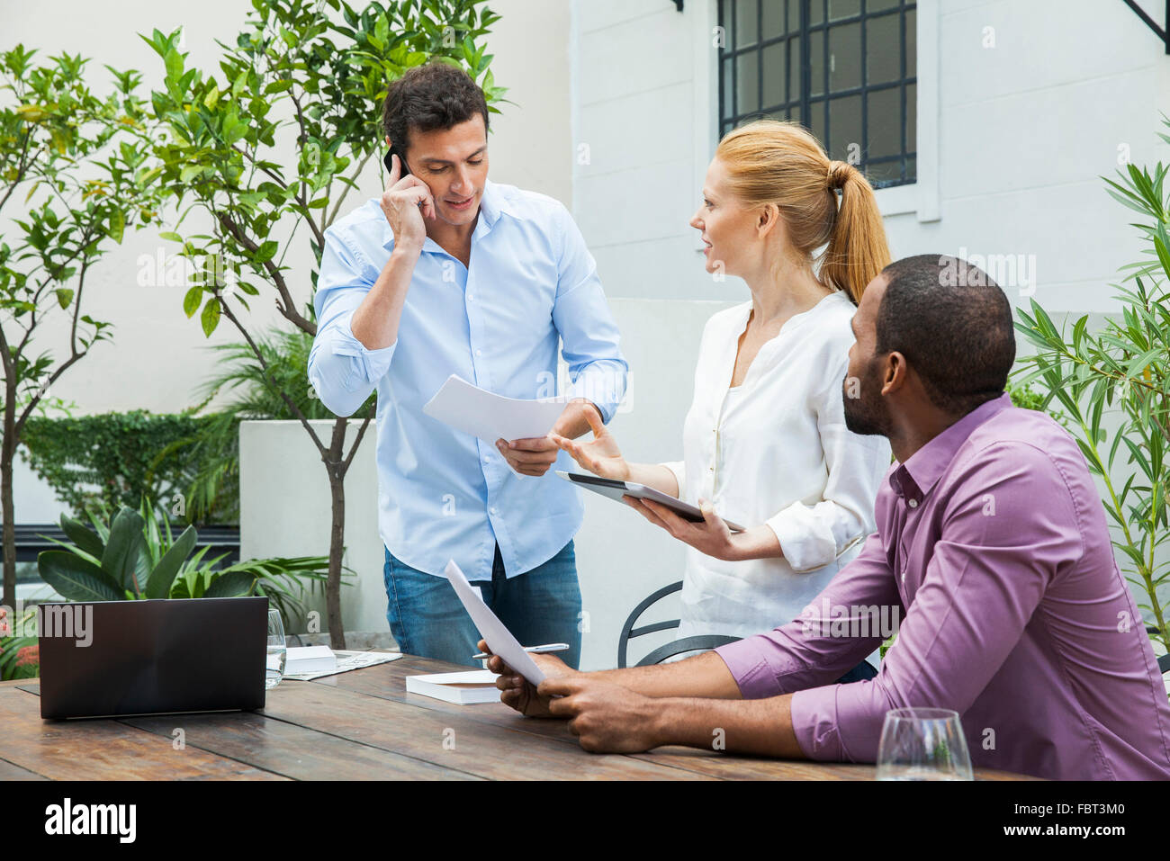 Team collaborating on digital hi-res stock photography and images - Alamy